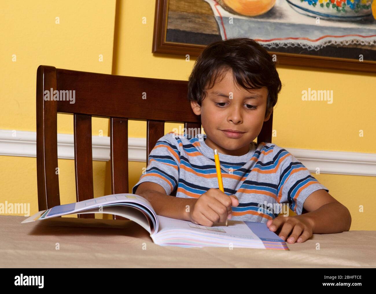 Child studying at dinner table hi-res stock photography and images - Alamy