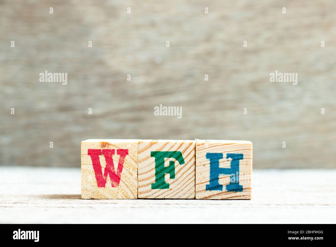 Alphabet letter in word wfh (work from home) on wood background Stock ...