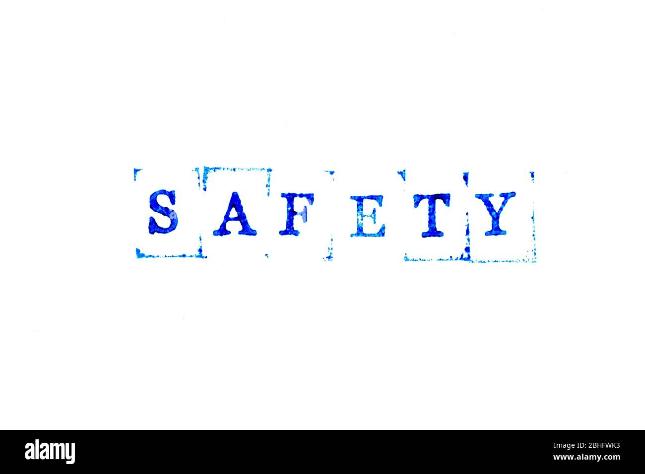Blue ink of rubber stamp in word safety on white paper background Stock ...