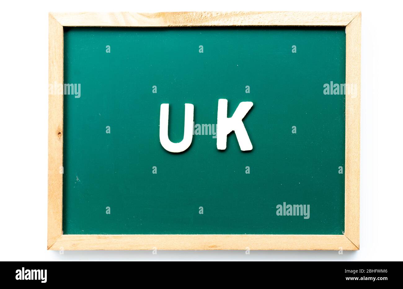 Wood letter with word UK (abbreviation of united kingdom) on blackboard ...