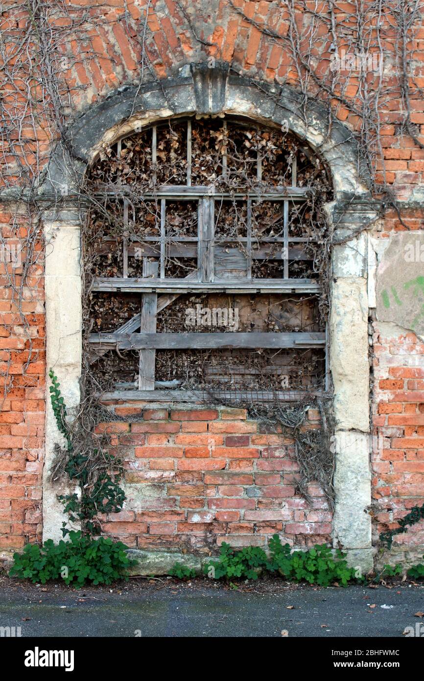 Boarded and closed creepy looking old venetian style red brick ... Boarded and closed creepy looking old venetian style red brick ...