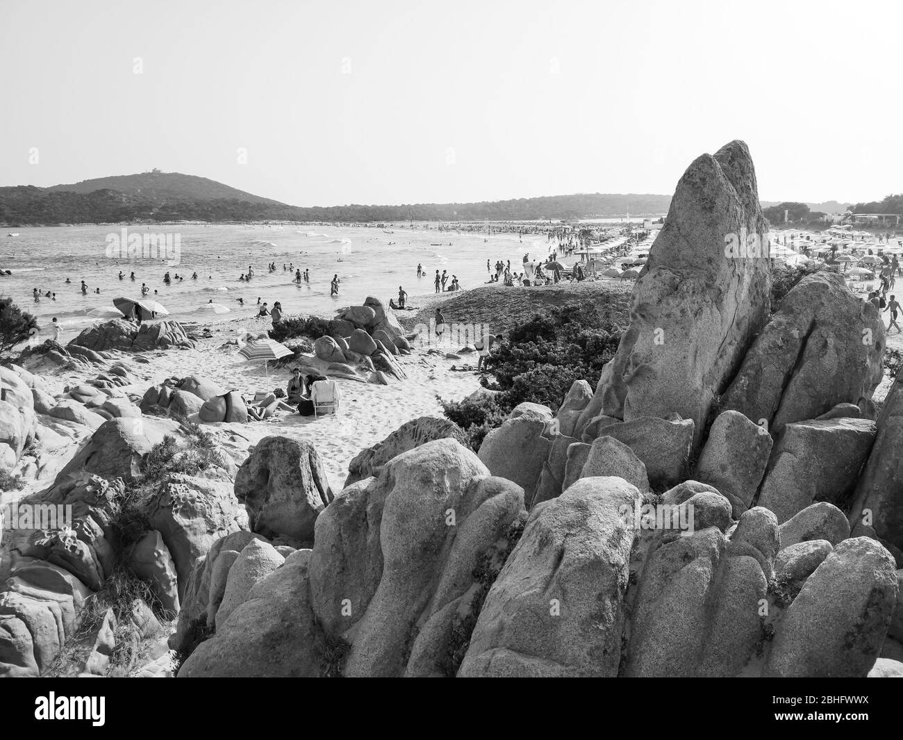 Sardinia, Italy - August 7, 2019: Tourists and bathers on the sand and ...