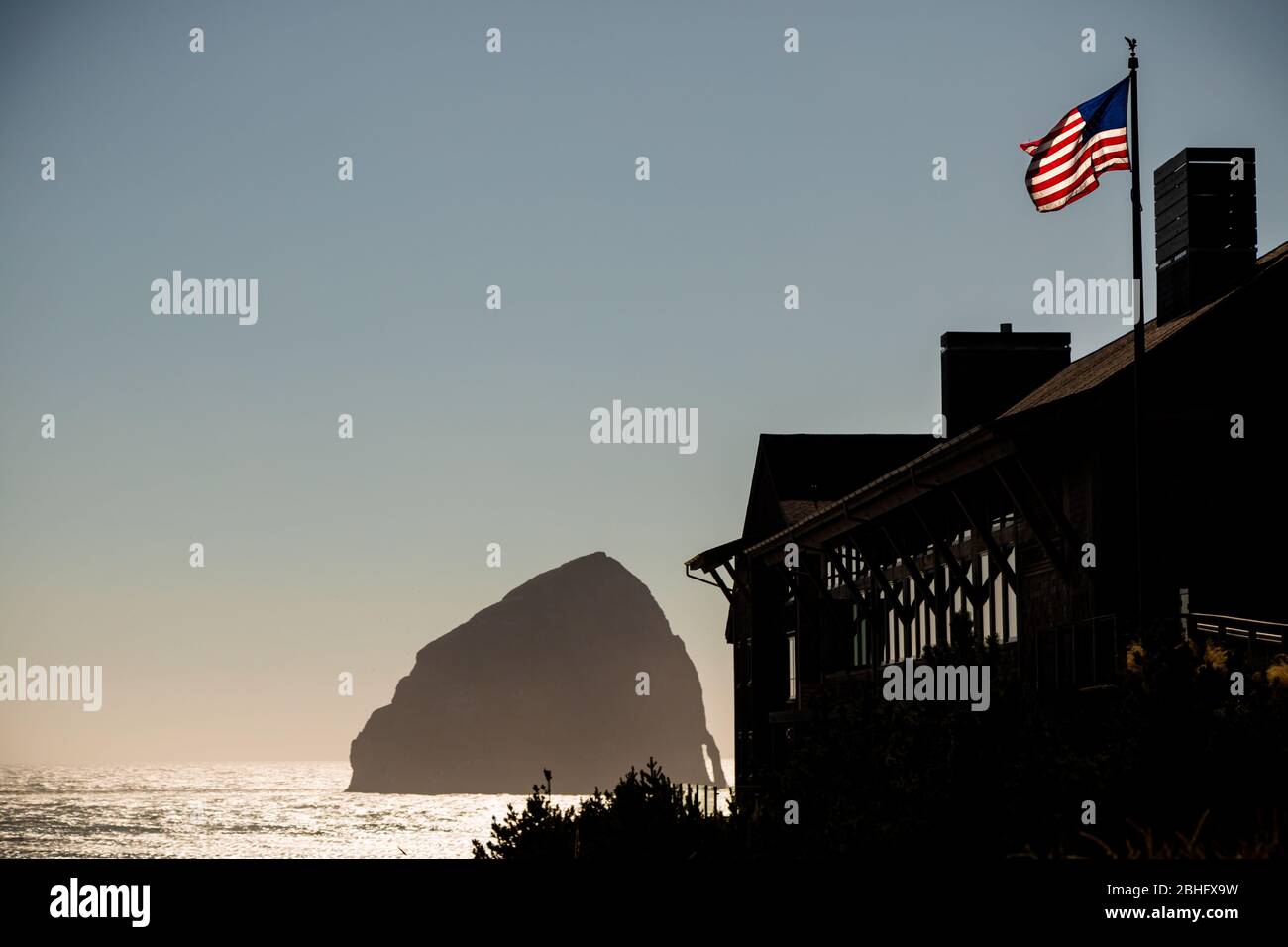 An American flag pole with an island in the distance near in Cape ...