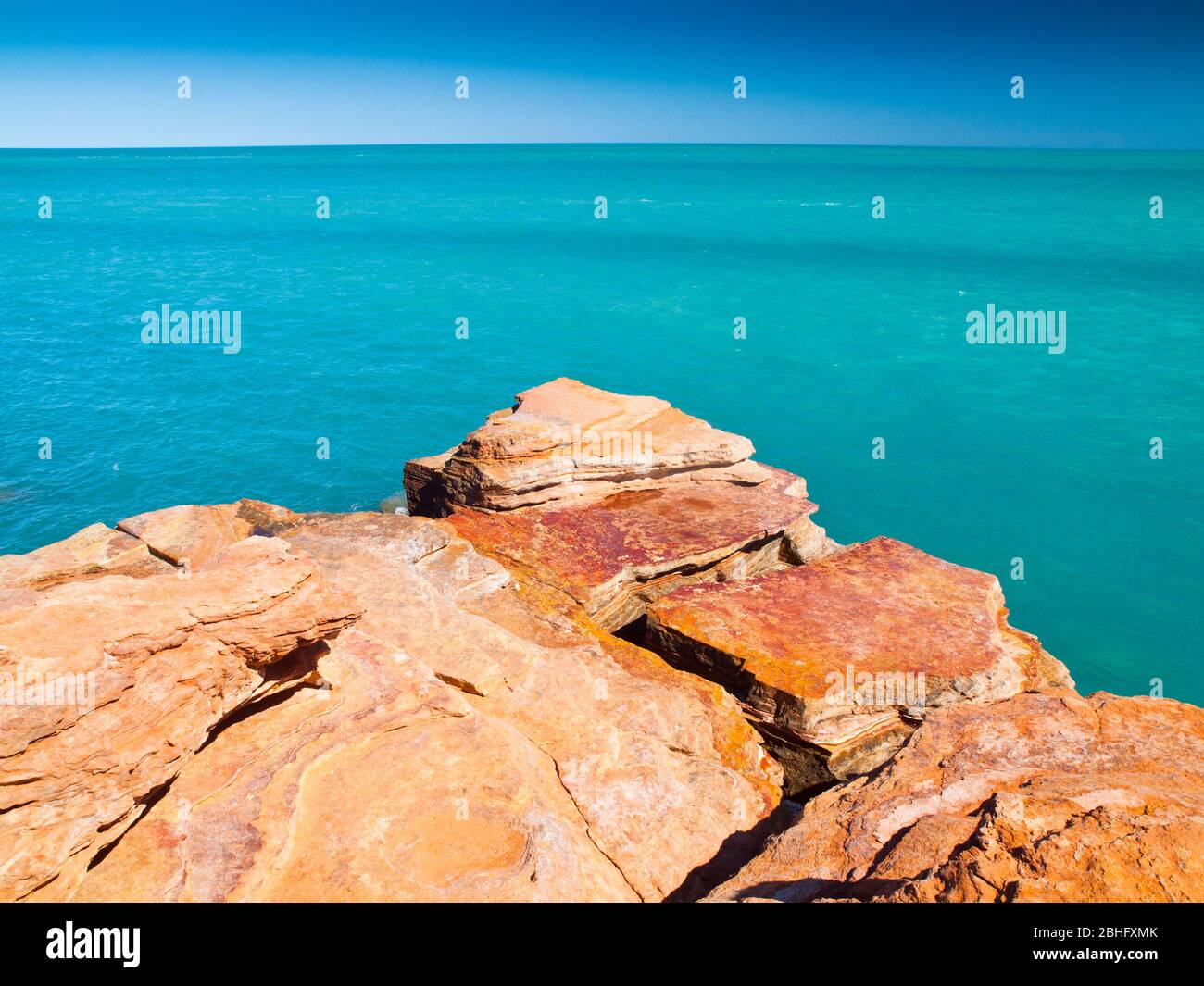 Red sandstone clifftop and turquoise Indian Ocean near Gantheaume Point ...