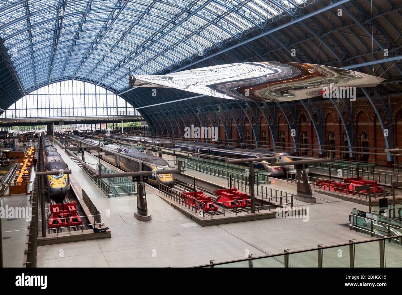 A train station with multiple trains in the station Stock Photo - Alamy