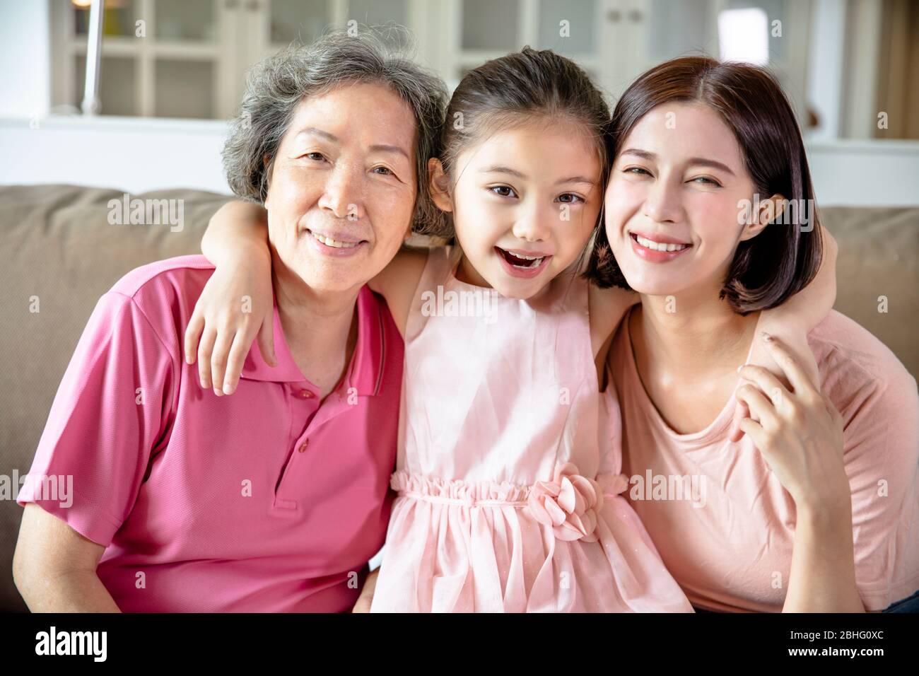 happy grandmother and daughter with granddaughter at home Stock Photo ...