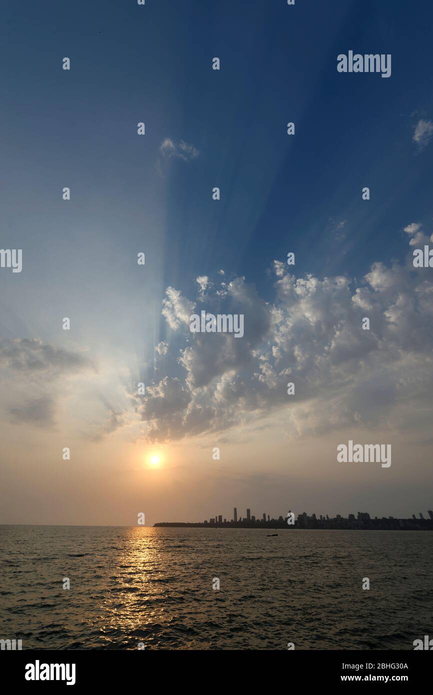 Beautiful clouds and sun rays in evening at sunset from Marine Drive ...