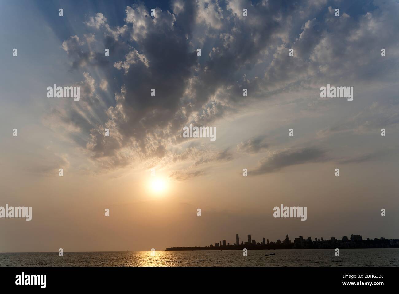Beautiful clouds and sun rays in evening at sunset from Marine Drive ...