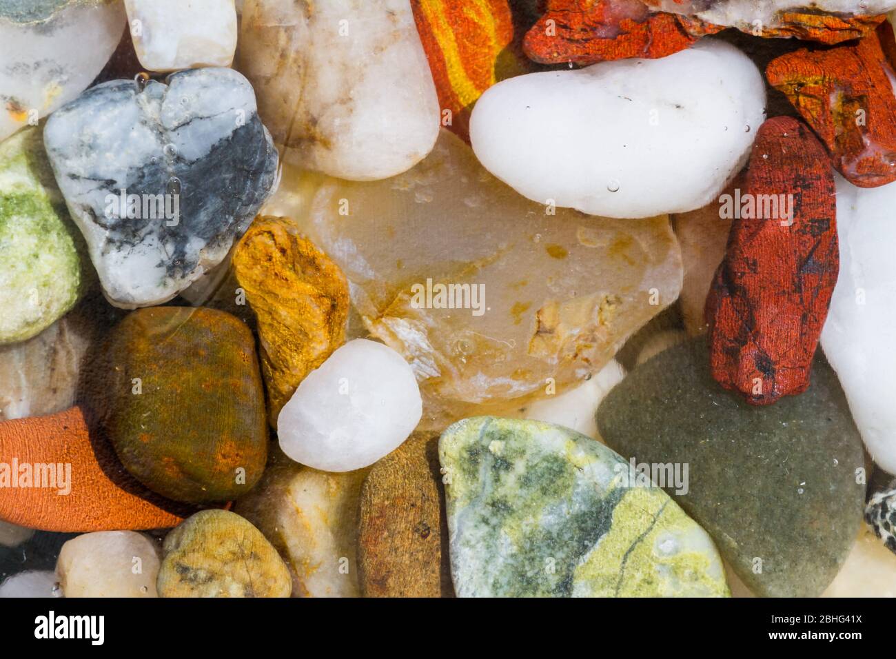 close up of a bunch of small naturally polished stones found in the ...