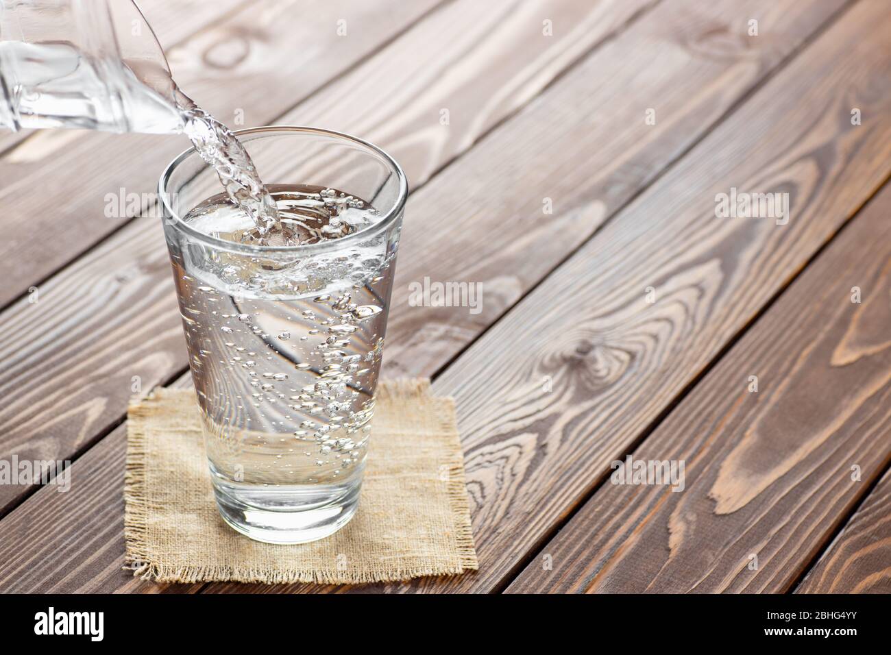 water pouring from jug into glass Stock Photo - Alamy