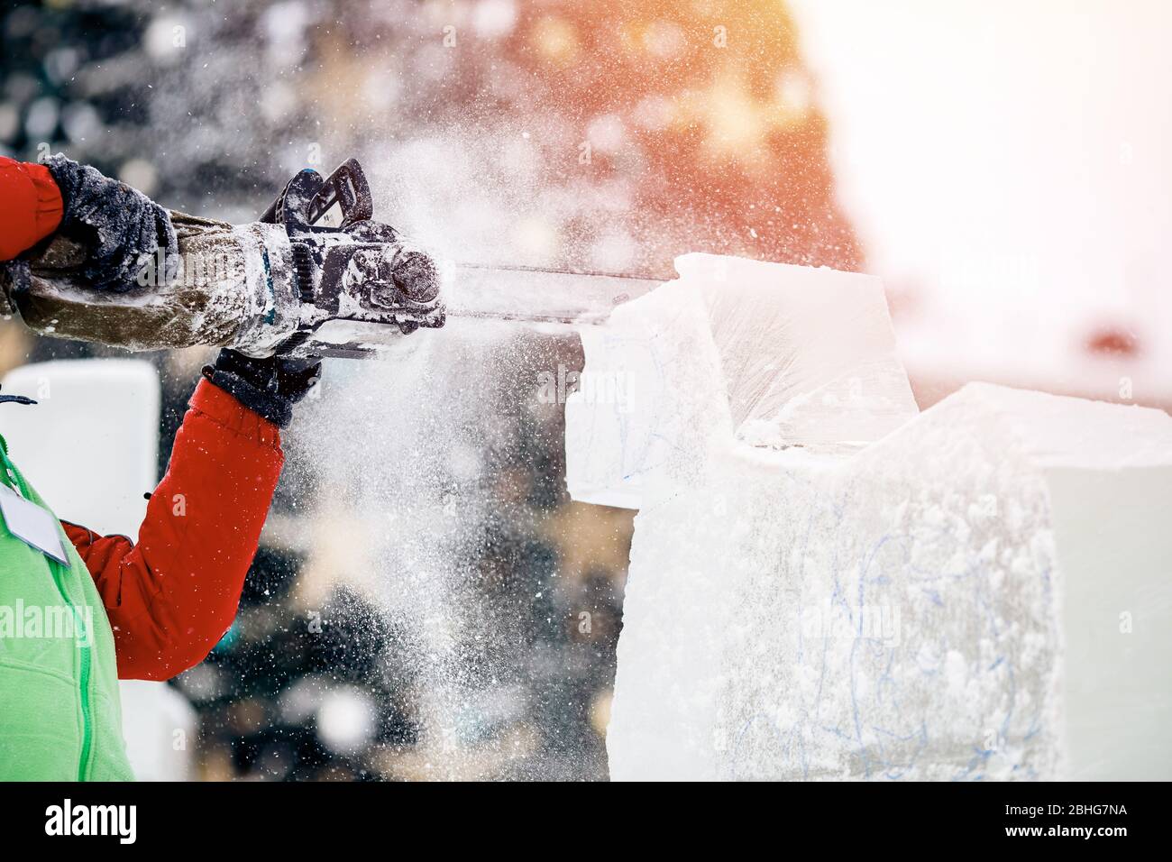 Ice sculpture carving man use chainsaw cut frozen winter Stock Photo ...