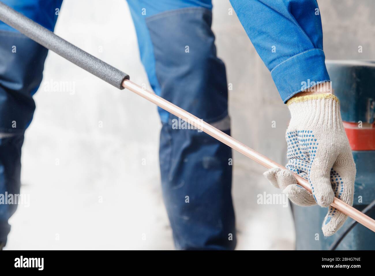 Worker man Installation of pipe channel for connecting air conditioner ...