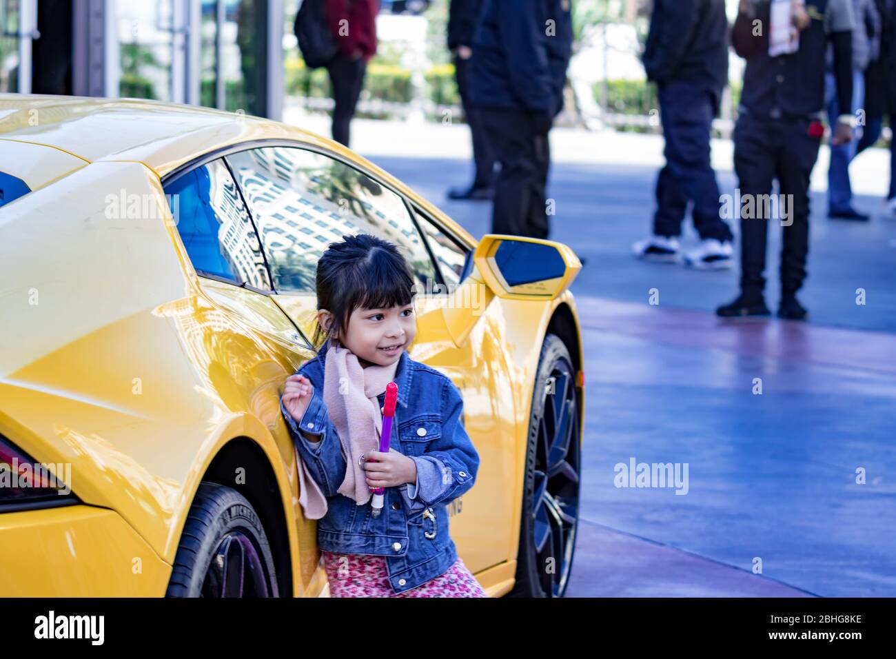 Cute Kid and a Yellow Lamborghini by Exotic Racing parked at the Las ...