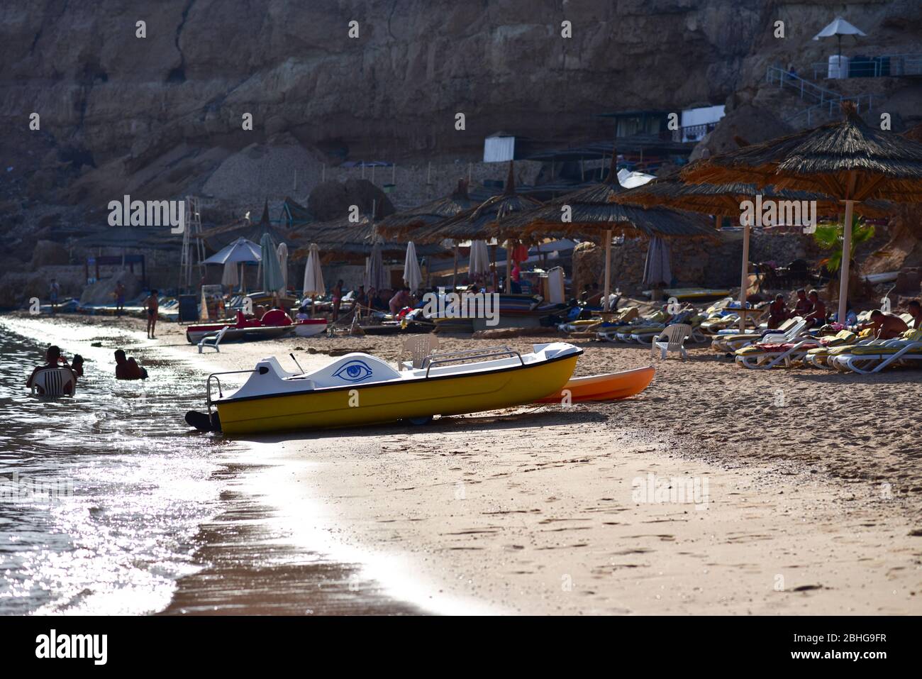 Water catamaran on the sea beach at sunset Stock Photo - Alamy