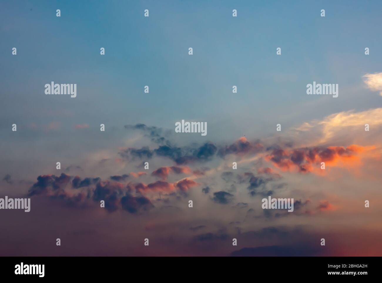 Sky and clouds reflected sunset light Stock Photo - Alamy