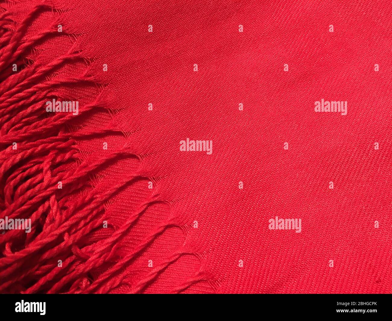 The edge of red yarn scarf texture wallpaper Stock Photo - Alamy