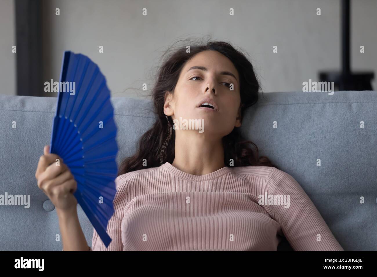 Too hot woman sweating fan hi-res stock photography and images - Alamy
