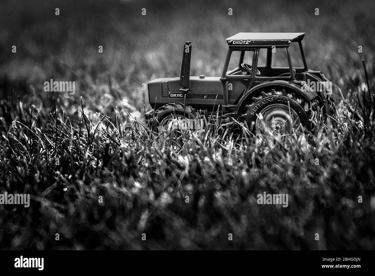 toy farm tractor on grass Stock Photo - Alamy
