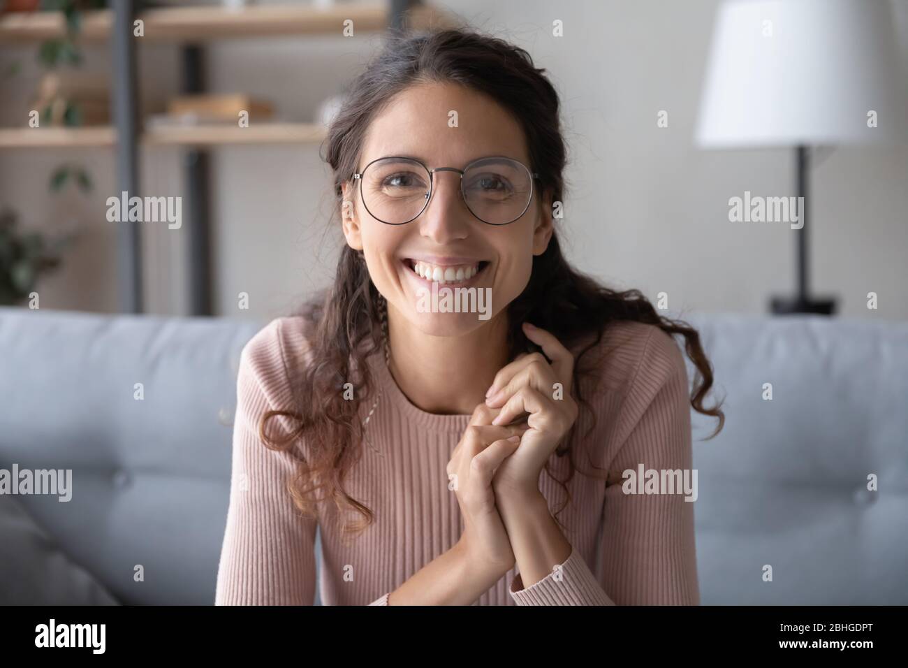 Beautiful smiling young woman holding video job interview Stock Photo ...