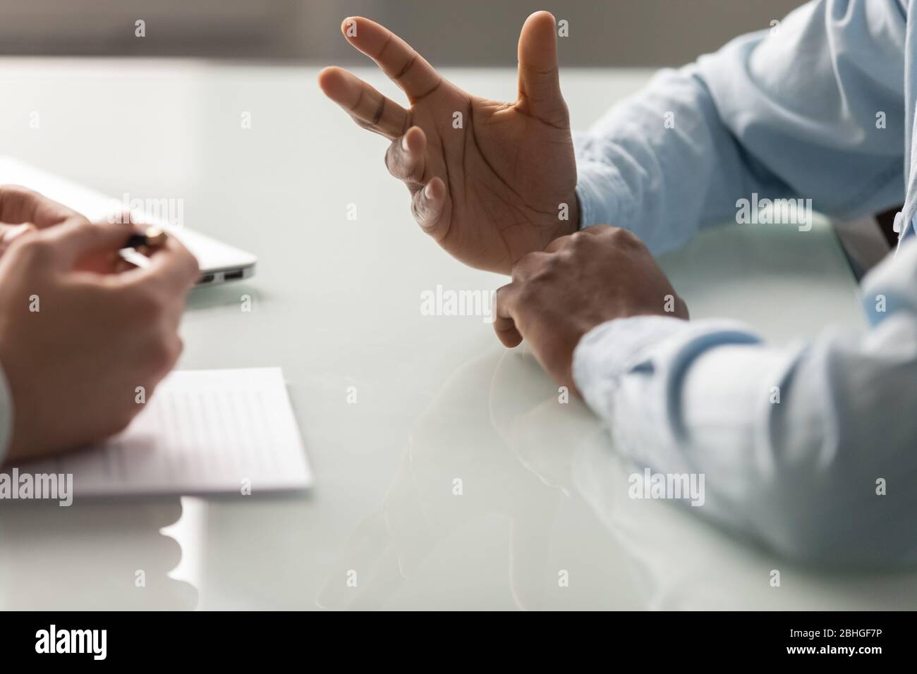 Close up diverse businessman hands talking at meeting Stock Photo - Alamy