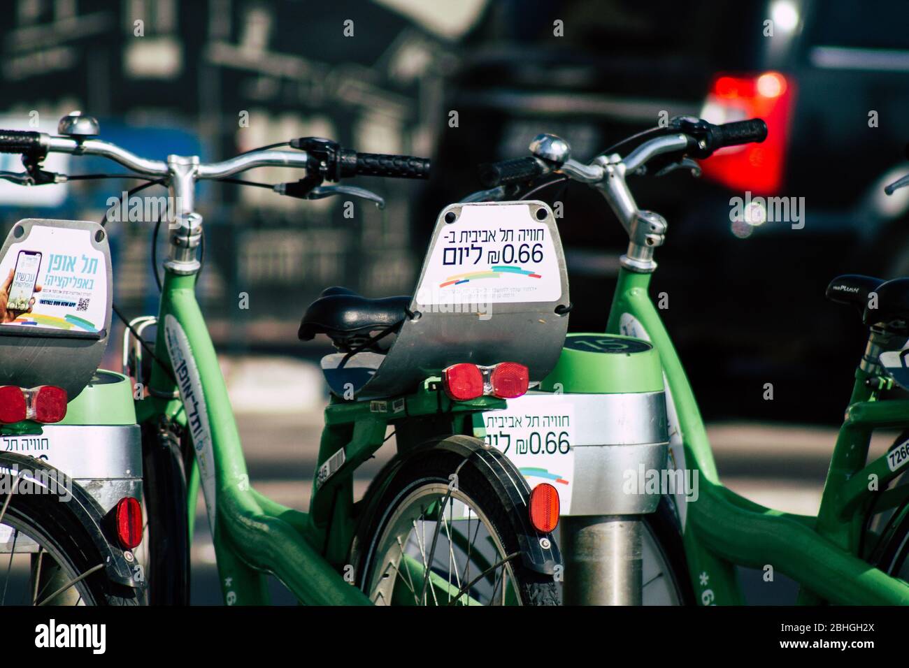 Tel Aviv Israel June 10, 2019 View of green electric bicycles to hire ...