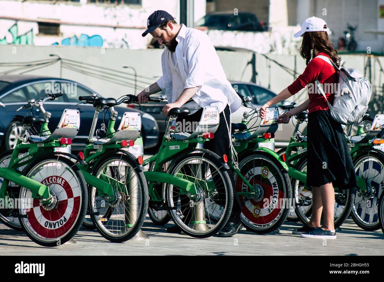 Tel Aviv Israel June 10, 2019 View of green electric bicycles to hire ...