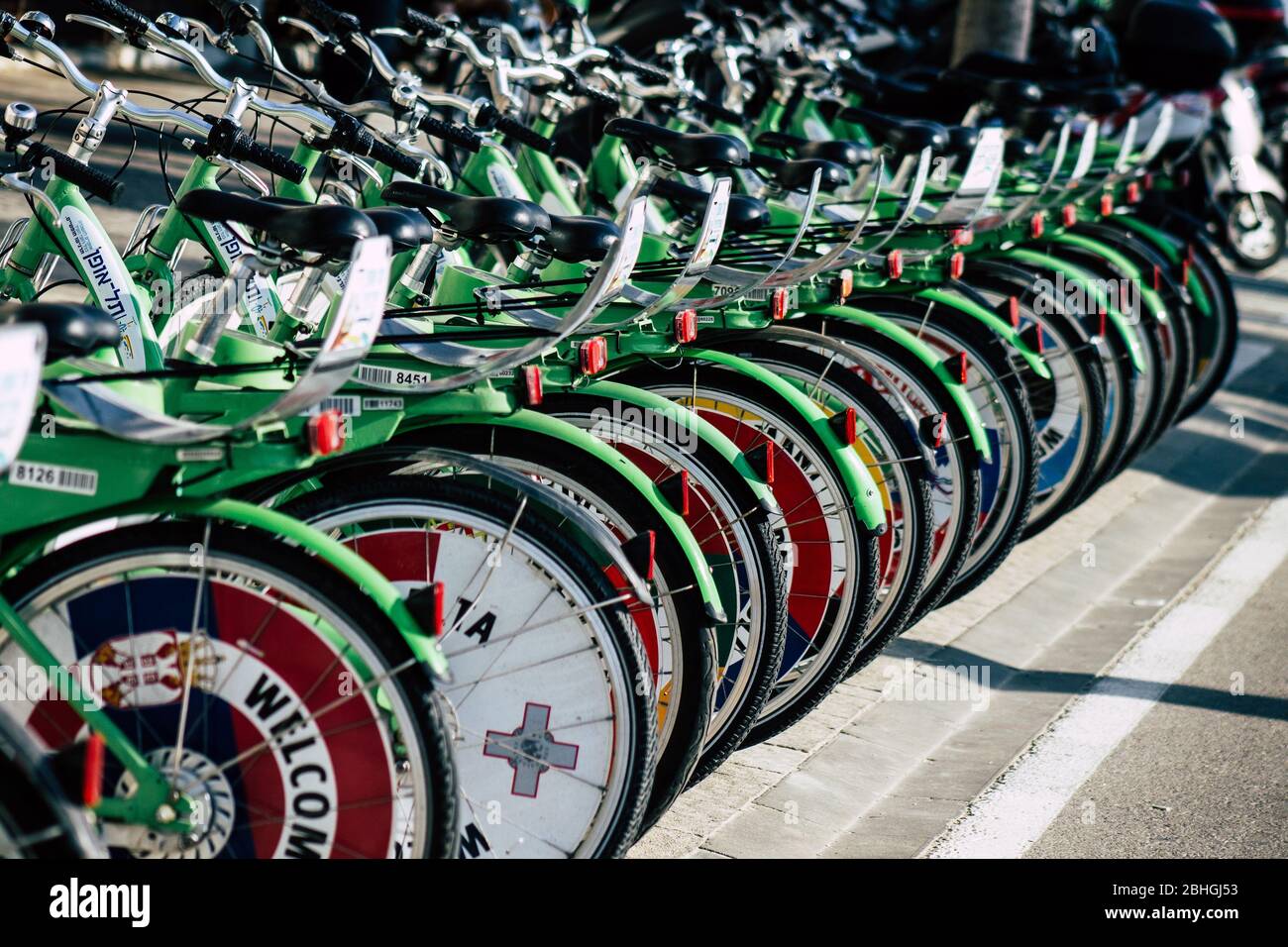 Tel Aviv Israel June 10, 2019 View of green electric bicycles to hire ...