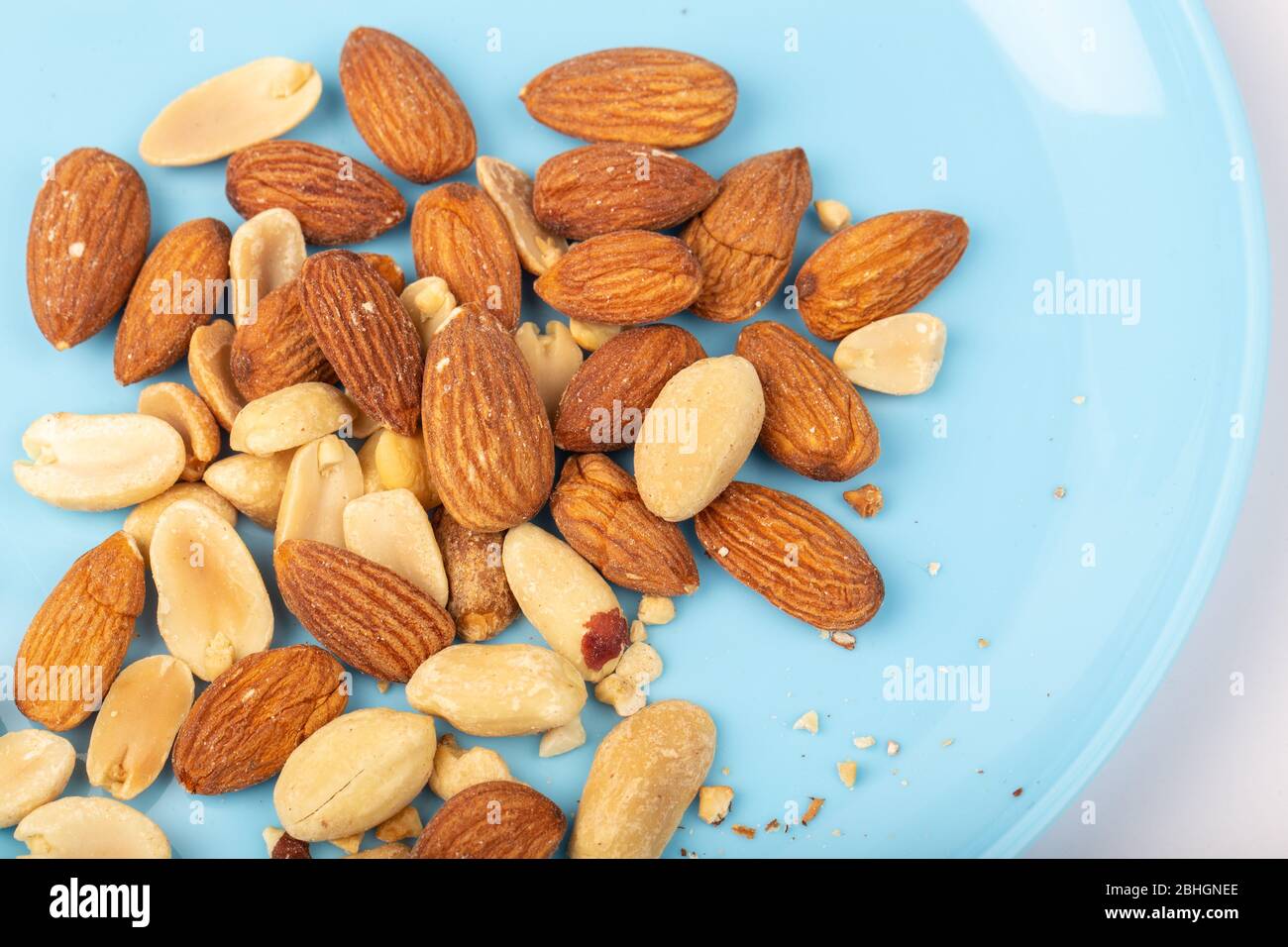 Healthy nuts on White Background. Nuts are a snack food consisting of ...