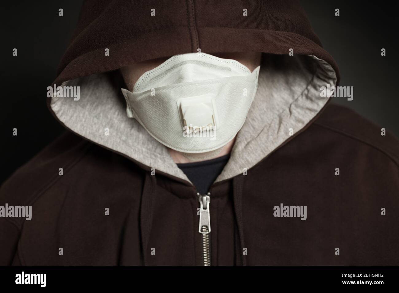 Aggressive man in medical face mask hiding Stock Photo - Alamy