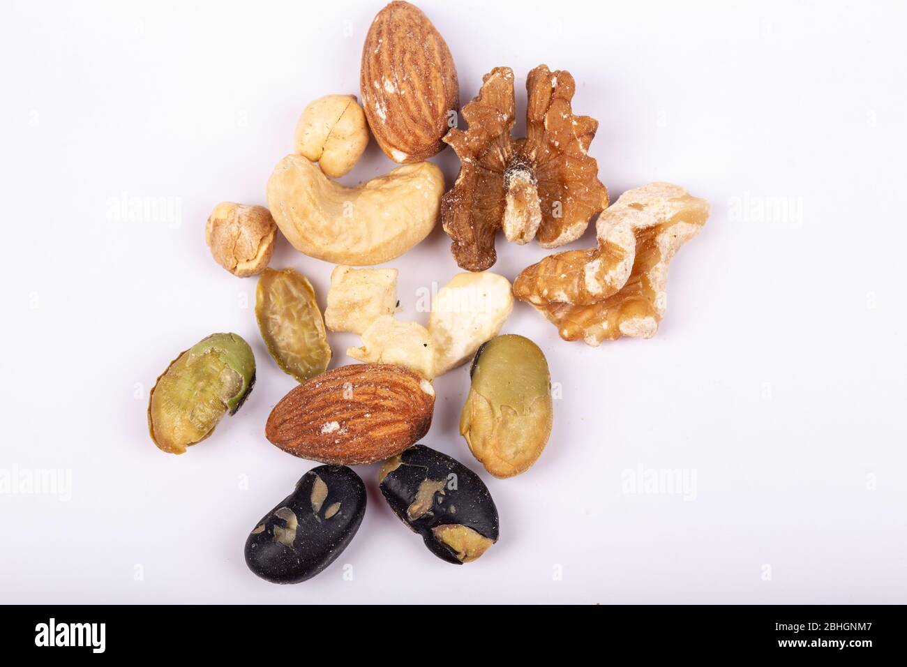 Healthy nuts on White Background. Nuts are a snack food consisting of ...
