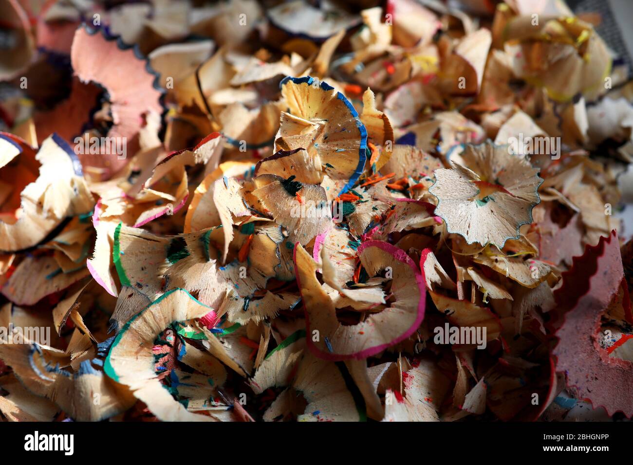 Coloured pencil sharpening's / shavings in an artists studio in London ...