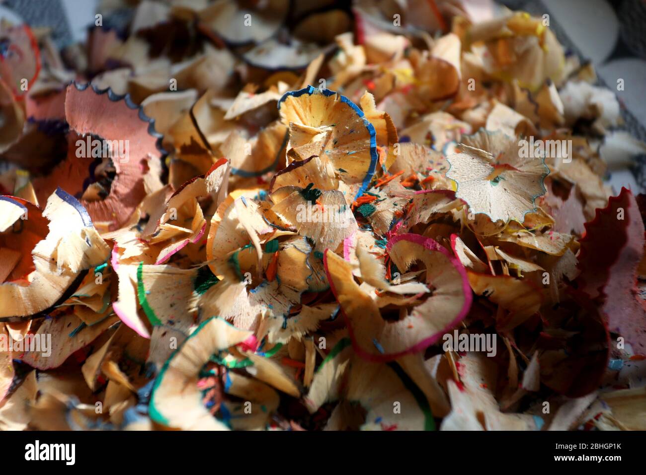 Coloured pencil sharpening's / shavings in an artists studio in London ...