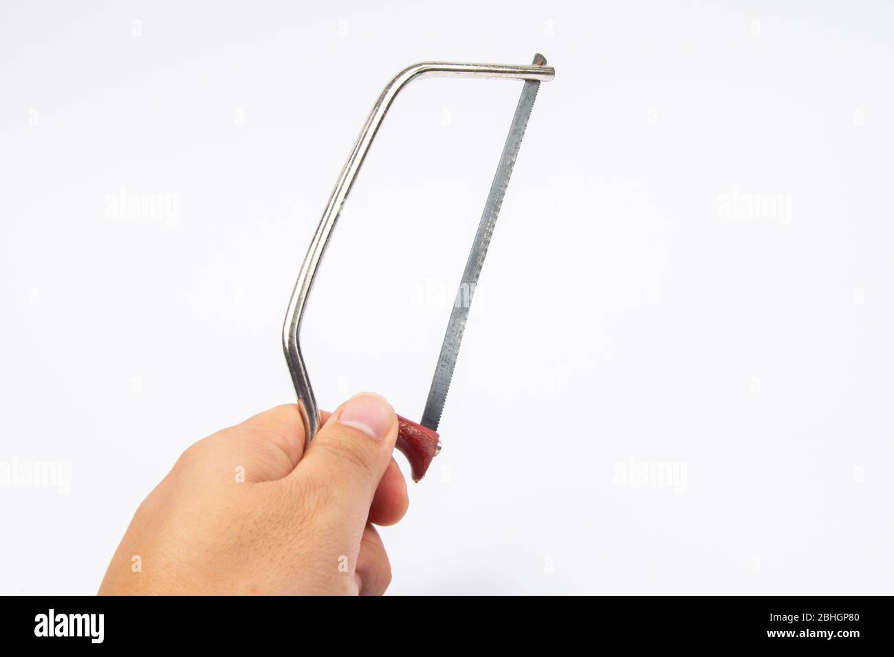 Man hand with Junior Hacksaw on a white background Stock Photo - Alamy