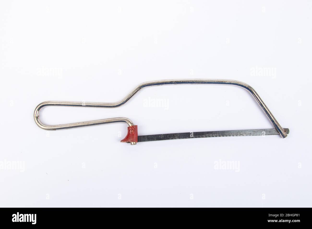 Man hand with Junior Hacksaw on a white background Stock Photo - Alamy