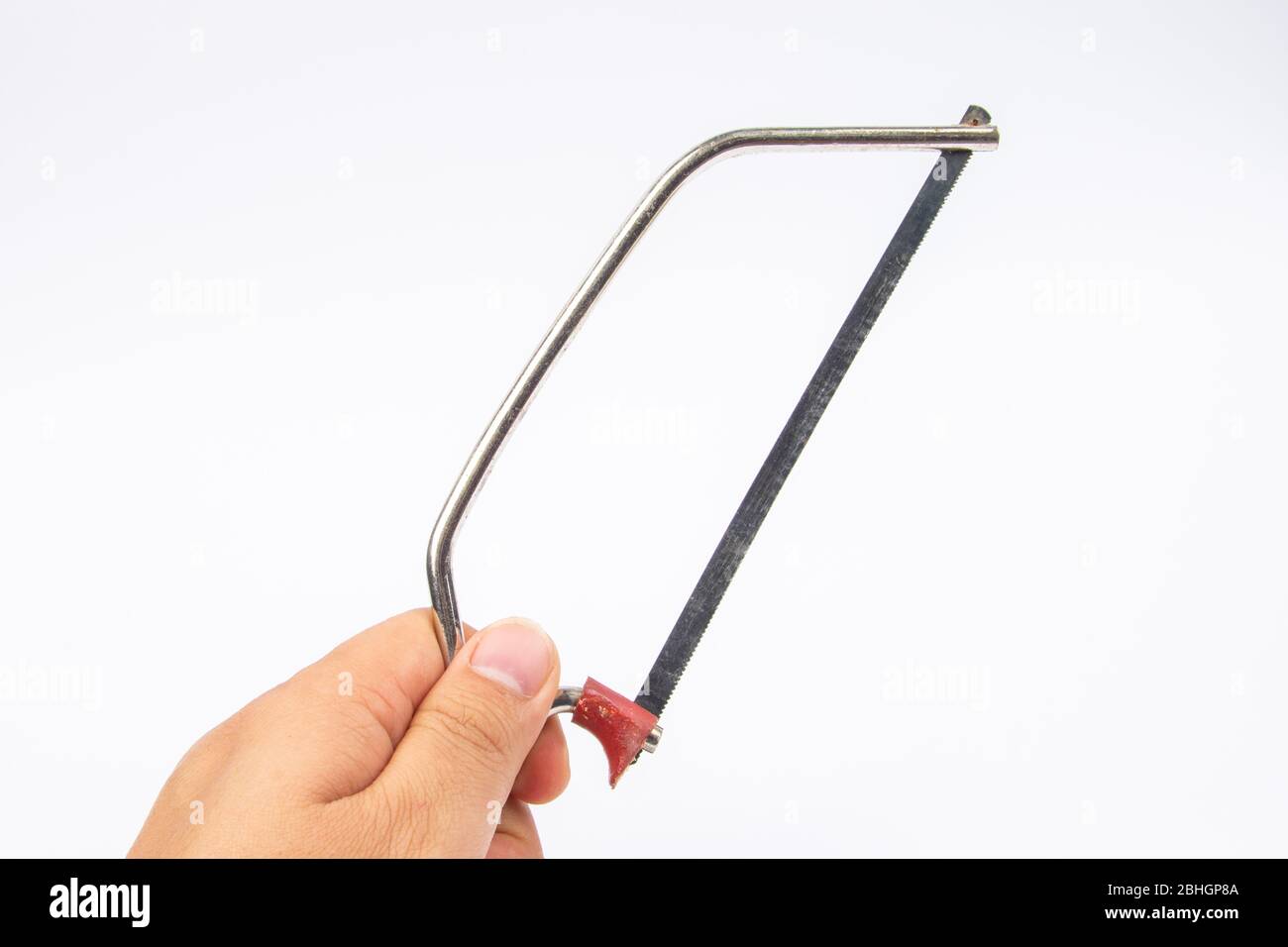 Man hand with Junior Hacksaw on a white background Stock Photo - Alamy