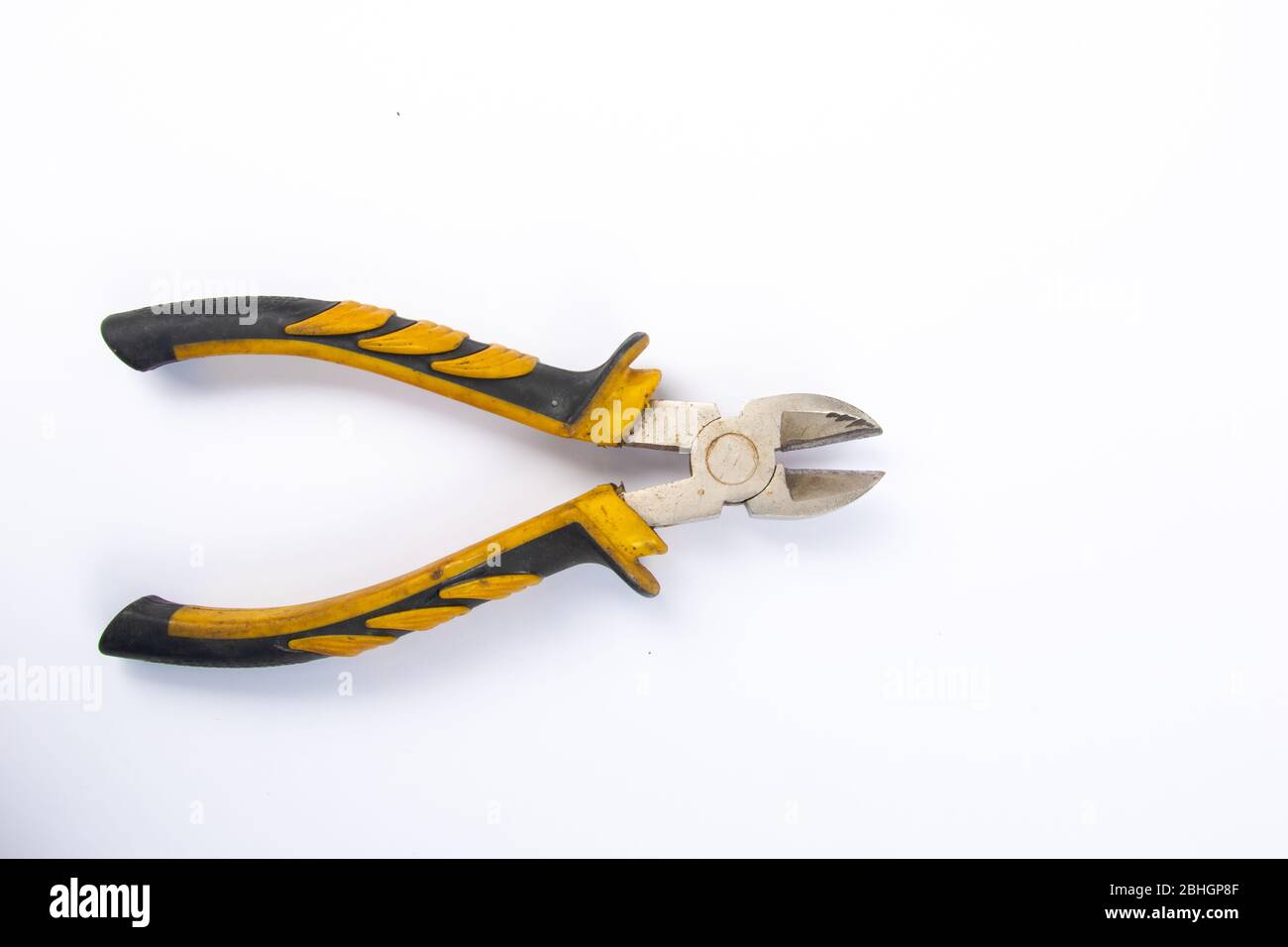 Side cutters with yellow and grey handle on white background Stock ...