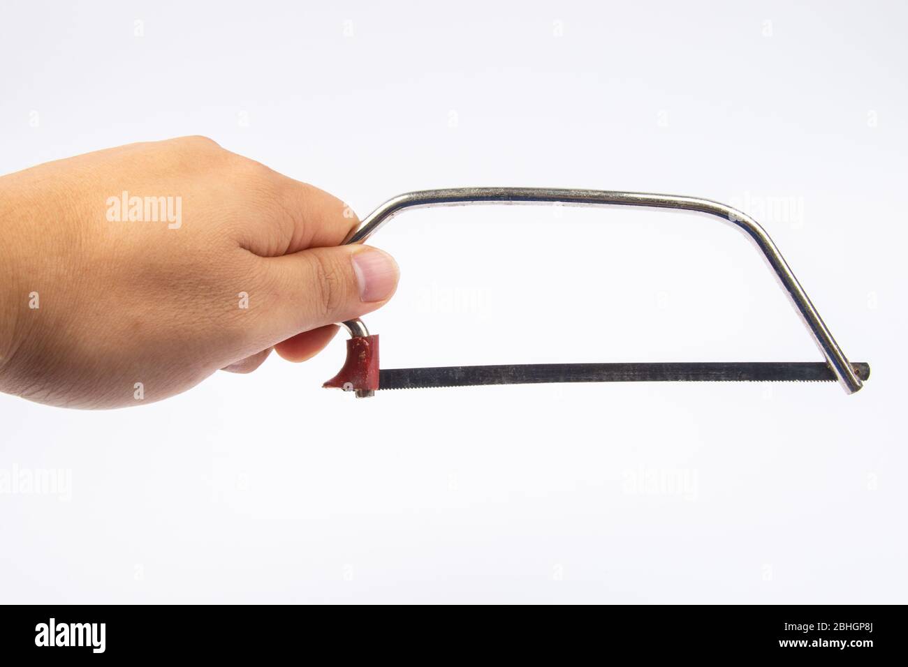 Man hand with Junior Hacksaw on a white background Stock Photo - Alamy