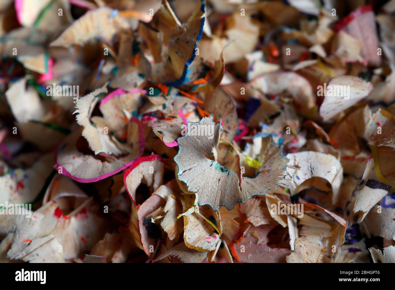 Coloured pencil sharpening's / shavings in an artists studio in London ...