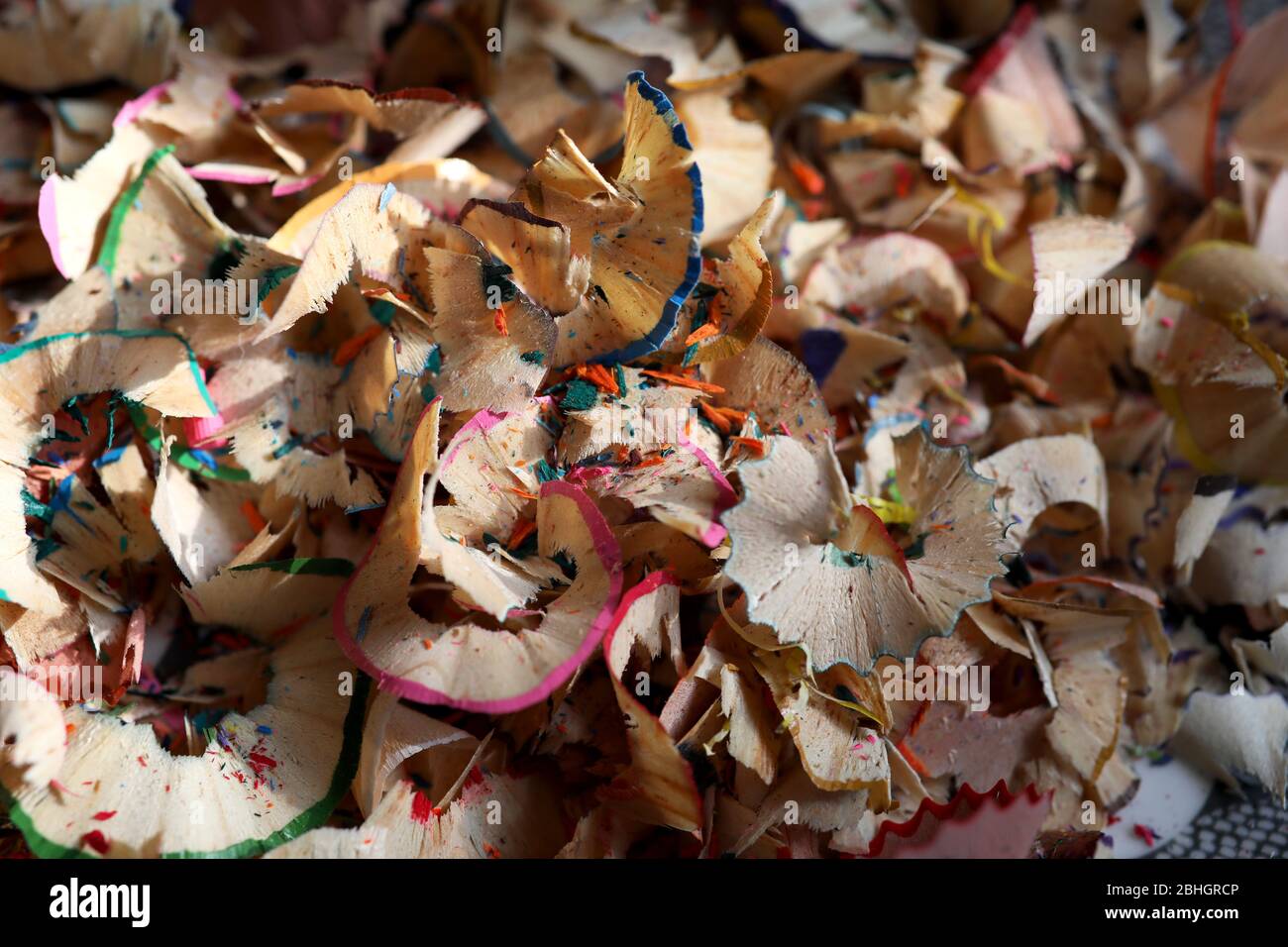 Coloured pencil sharpening's / shavings in an artists studio in London ...