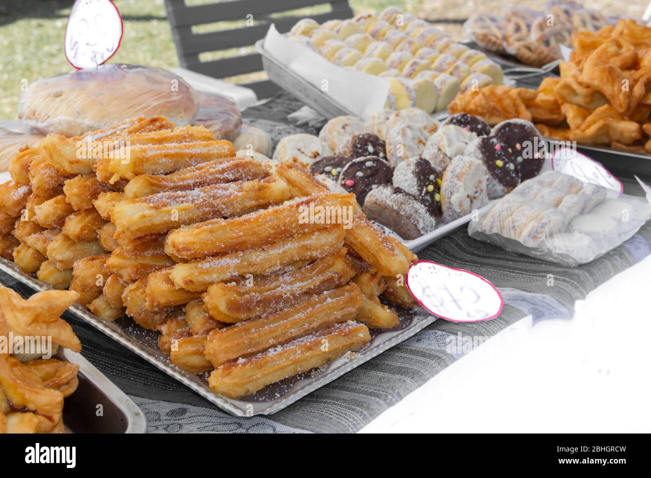 sweet churros and alfajores for sale at the street fair Stock Photo - Alamy