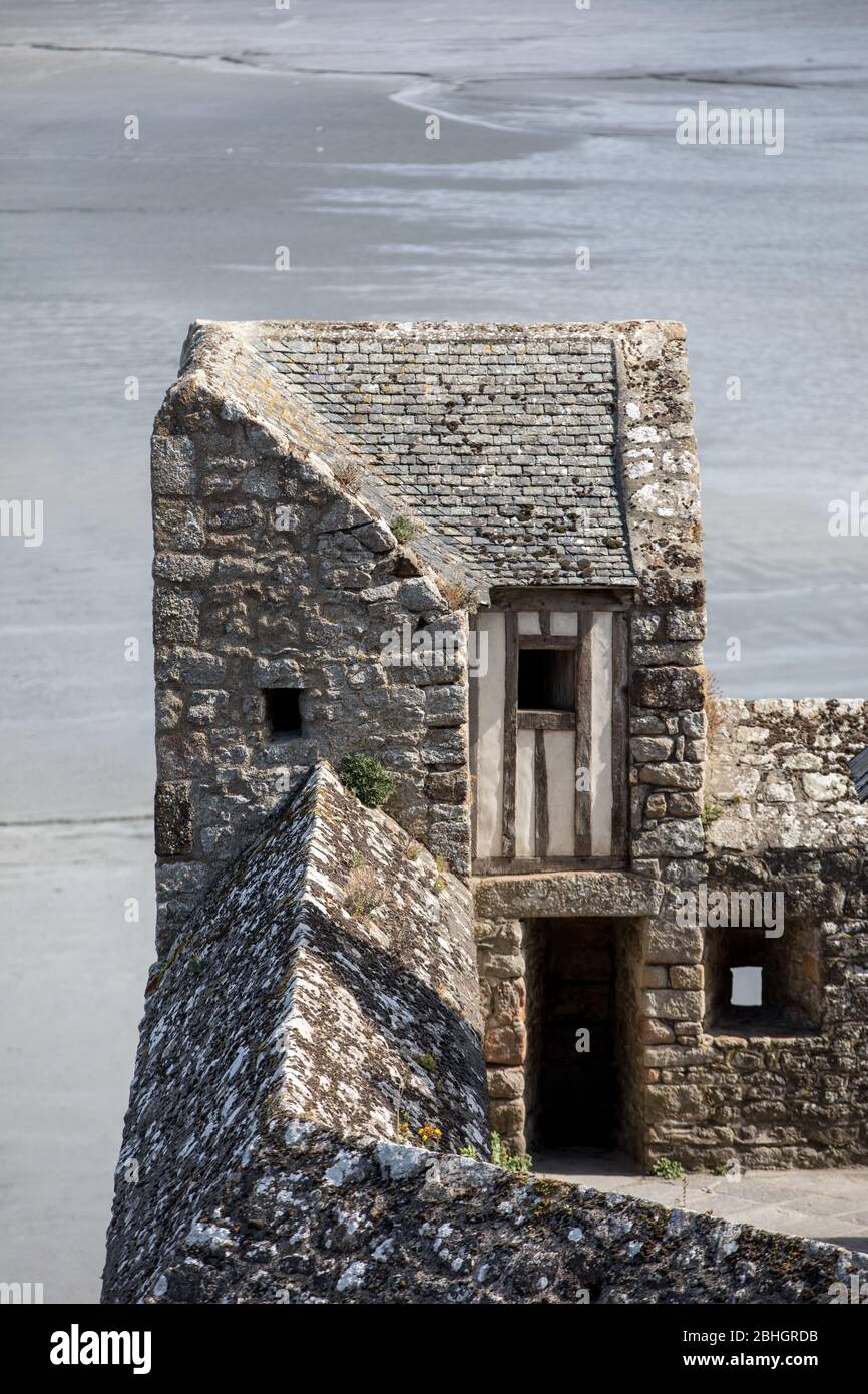 Mont Saint-Michel, the monastery and village on a tidal island between ...