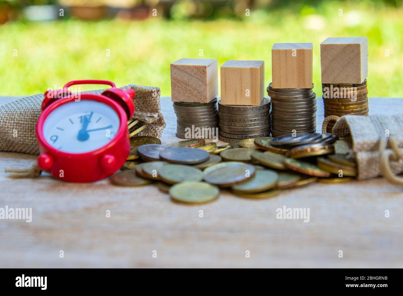 sack bag , Malaysia Ringgit coin and wooden blank block on wooden table ...