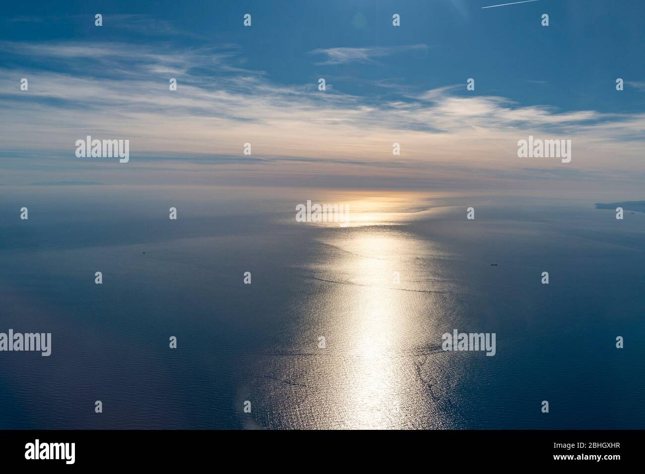 Airplane wing above ocean at sunrise hi-res stock photography and ...