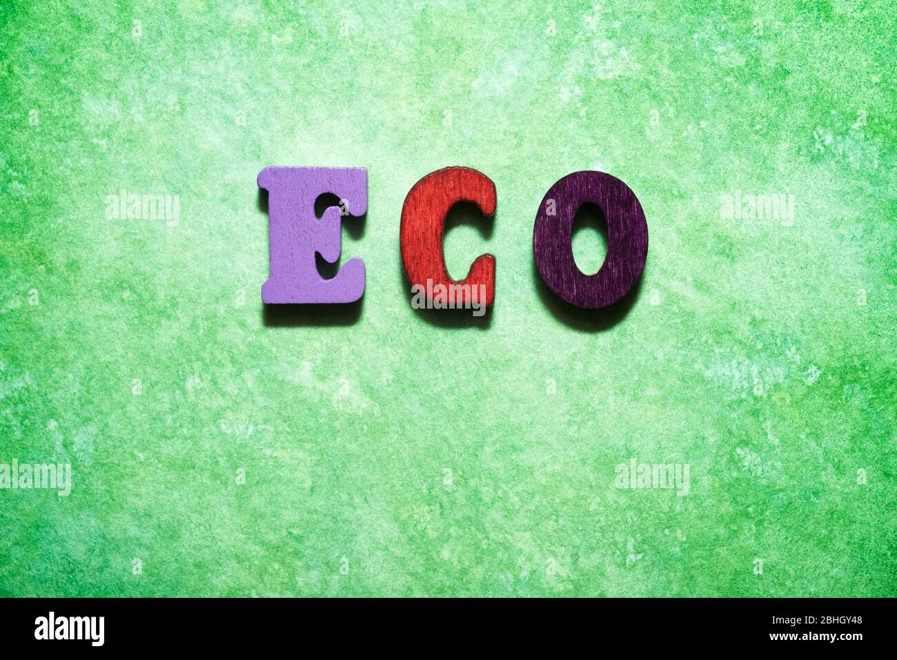 Eco word on a green paper Stock Photo - Alamy