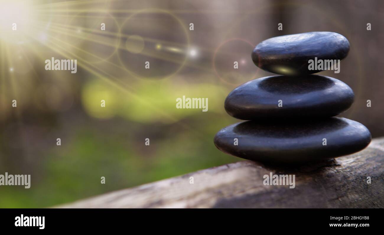 Beauty treatment and wellness background. Stacked massage stones stock ...
