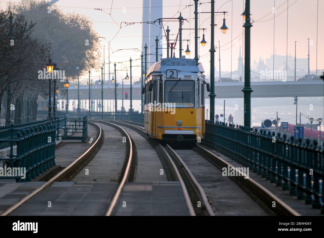 Old fashioned tram on a riverfront tramway in Budapest city, early ...