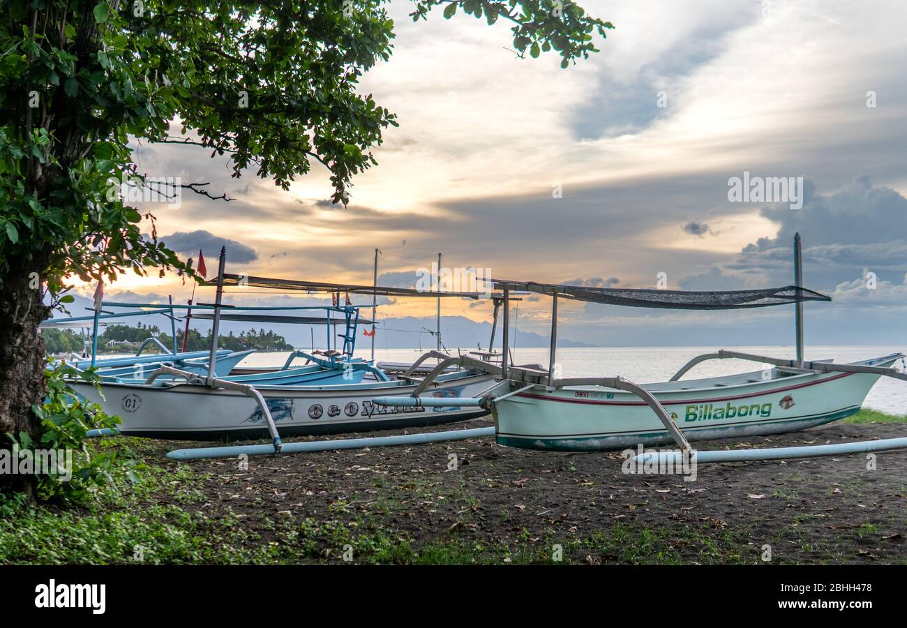 Balinese Boats on the beach in Northern Bali Stock Photo - Alamy