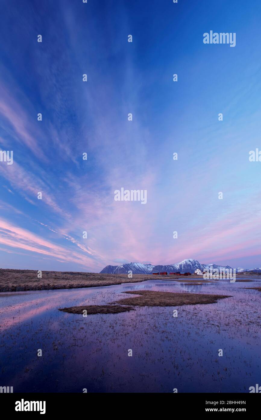 Dusk over coastal mountain lake near Leknes in the Lofoten Islands ...