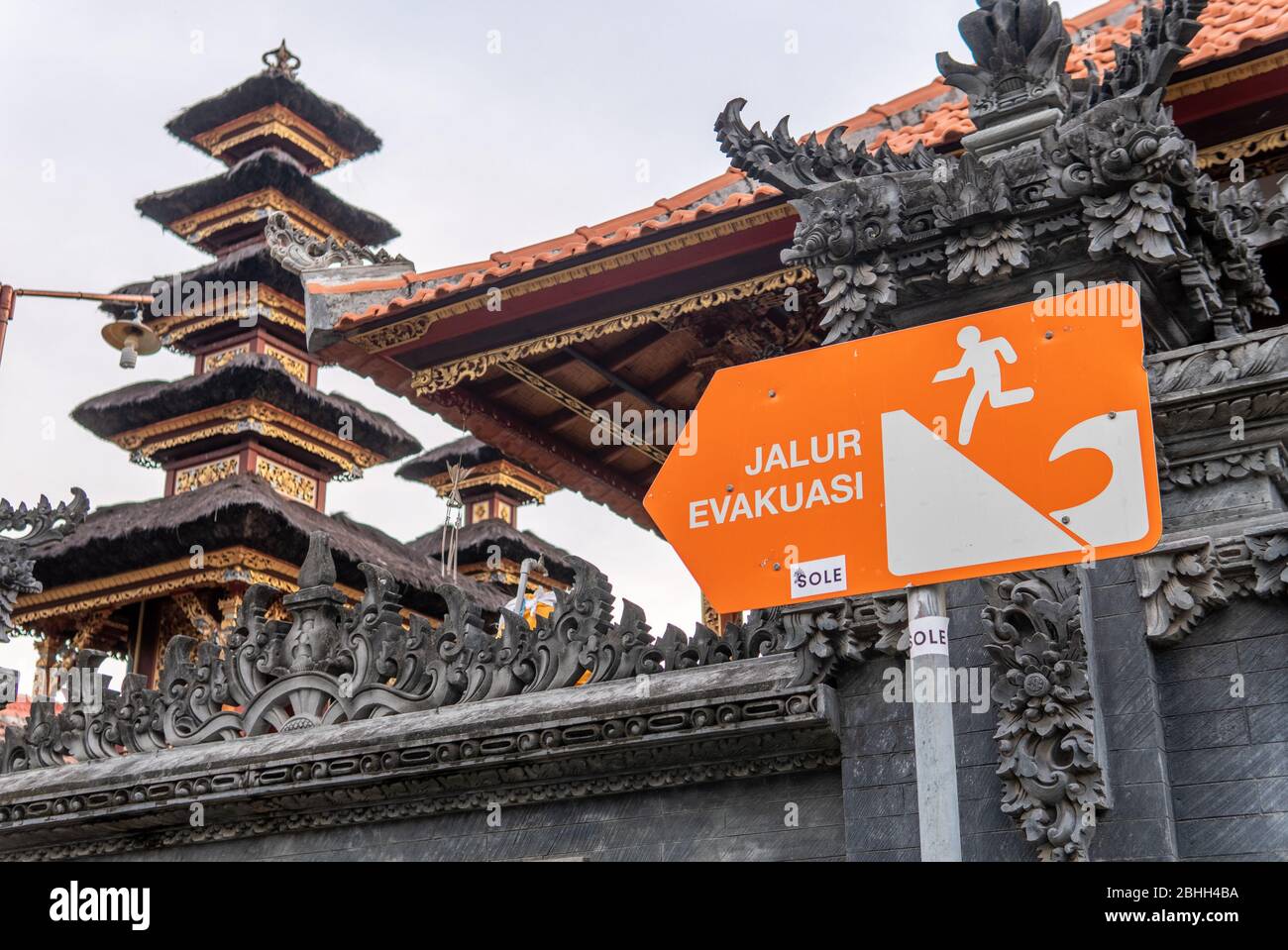 Balinese temple with tsunami warning sign Stock Photo - Alamy