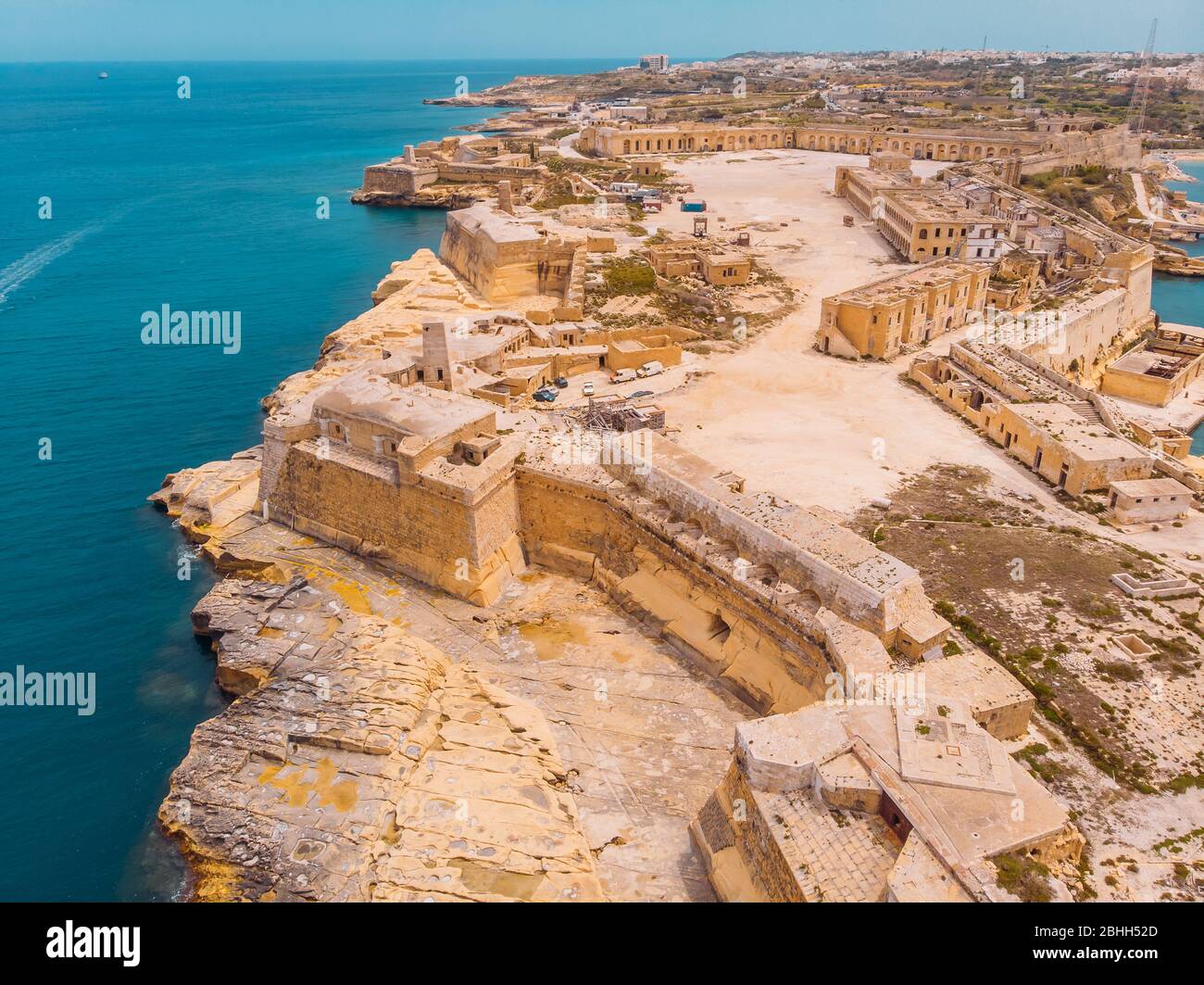 Ancient stone military fort Malta island made of brick rocks on shore ...